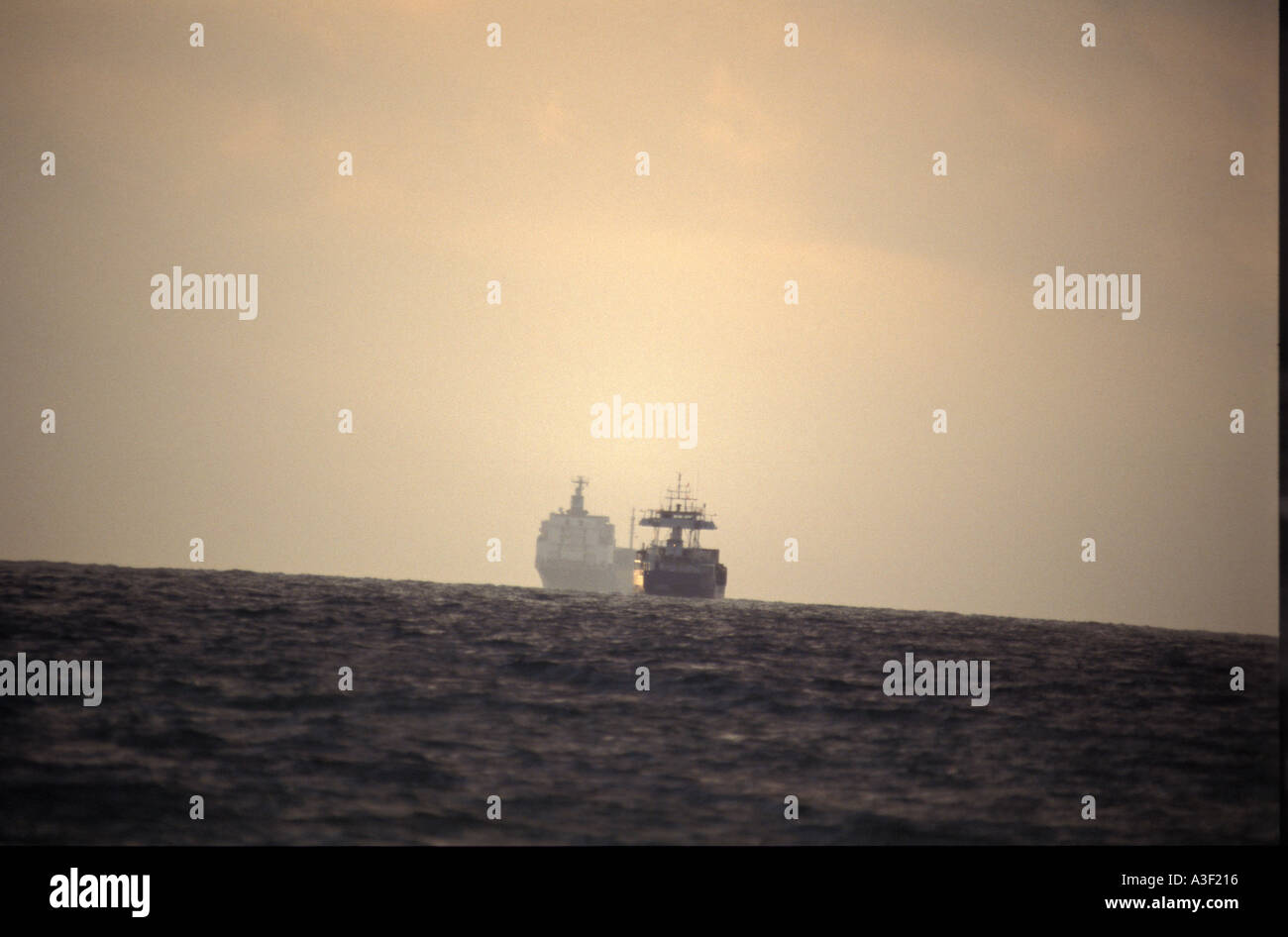 ship at sunset with cloud cumulus Stock Photo - Alamy