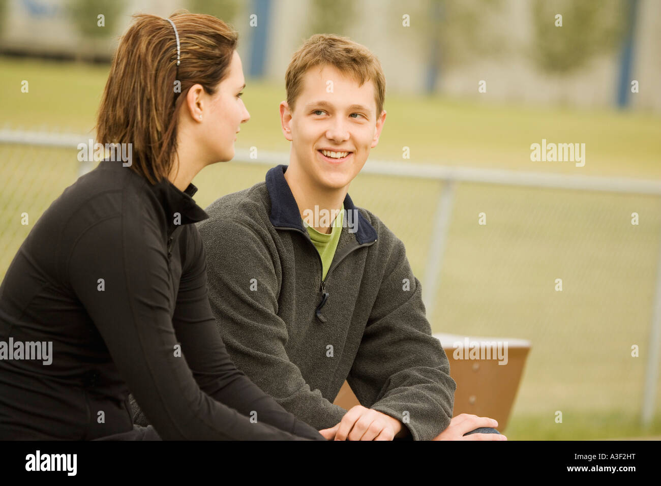Young couple talking Stock Photo - Alamy