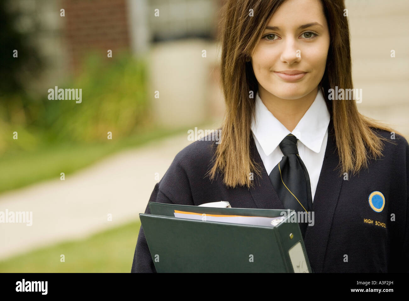 Young girl with binder Stock Photo - Alamy