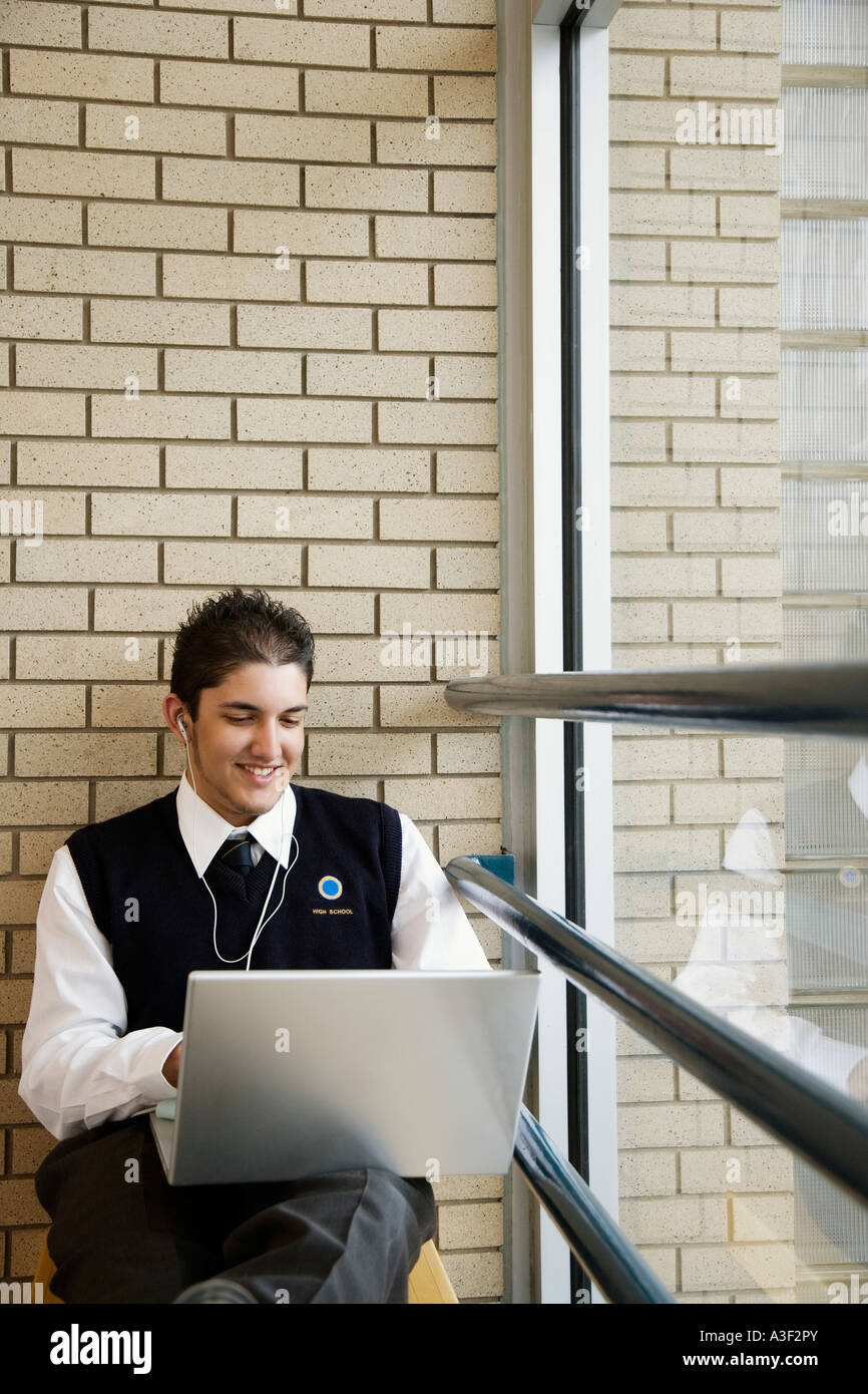 Student working on a laptop Stock Photo - Alamy