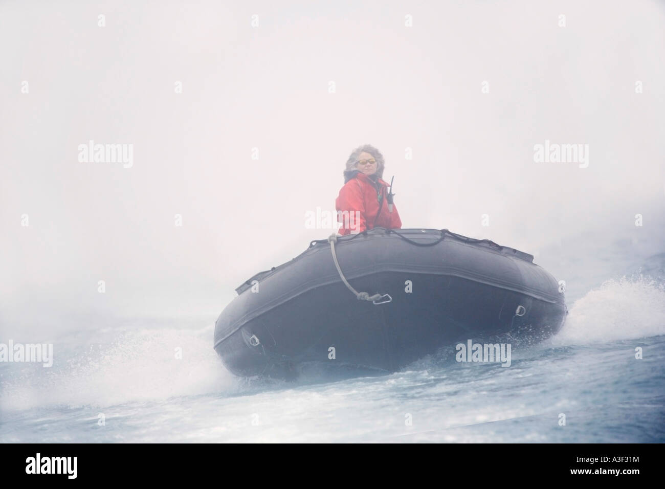 Woman riding a raft Stock Photo - Alamy