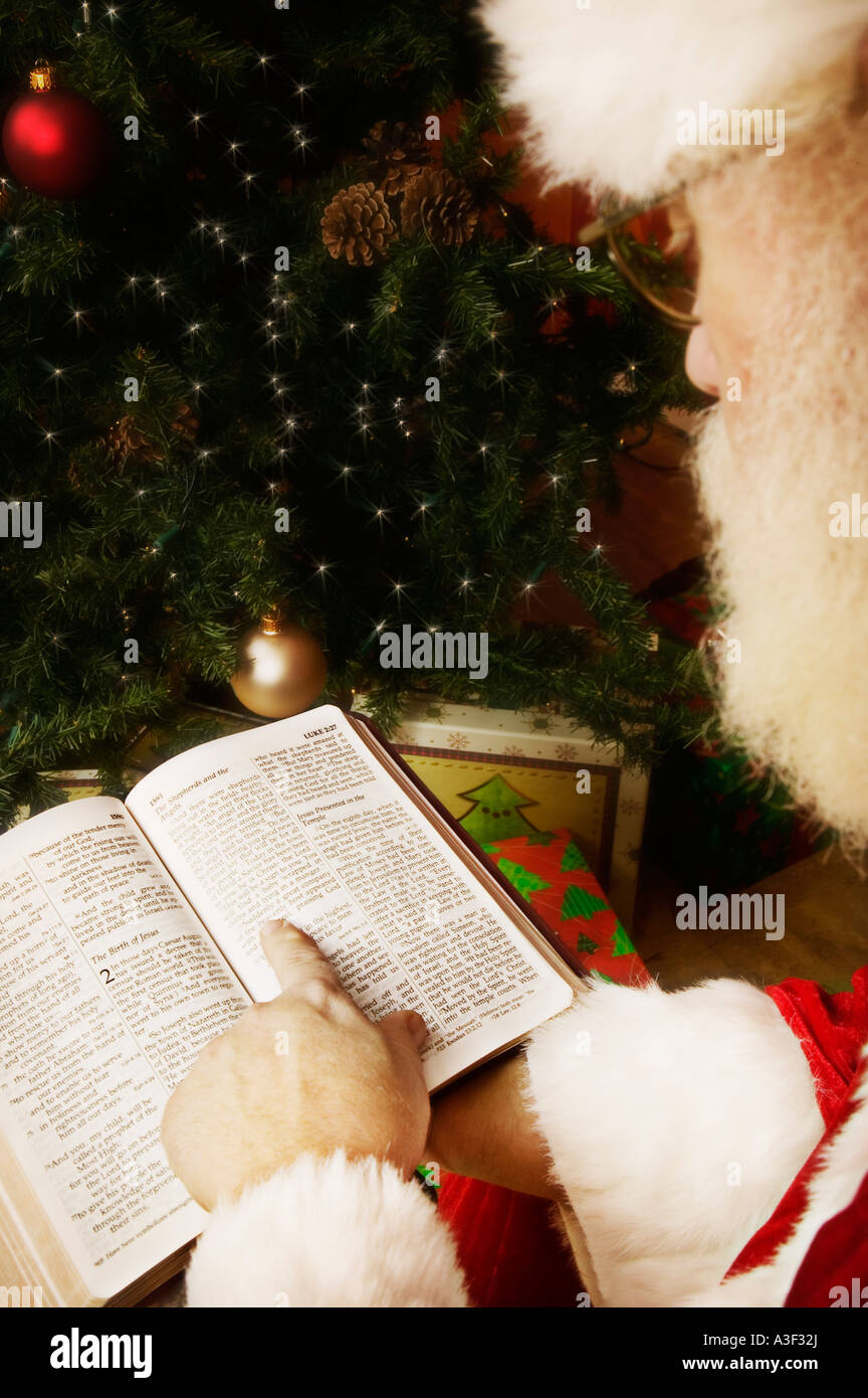Santa reading the Bible Stock Photo - Alamy