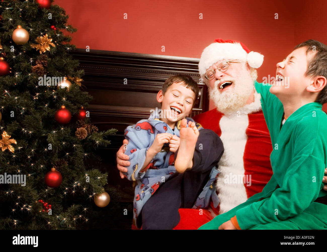 Santa laughing with children Stock Photo - Alamy