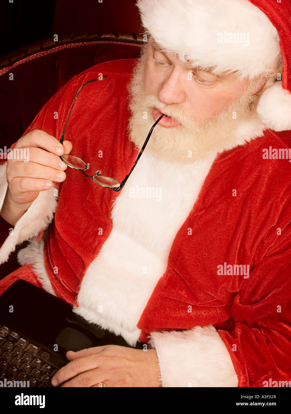 Santa making his list Stock Photo - Alamy