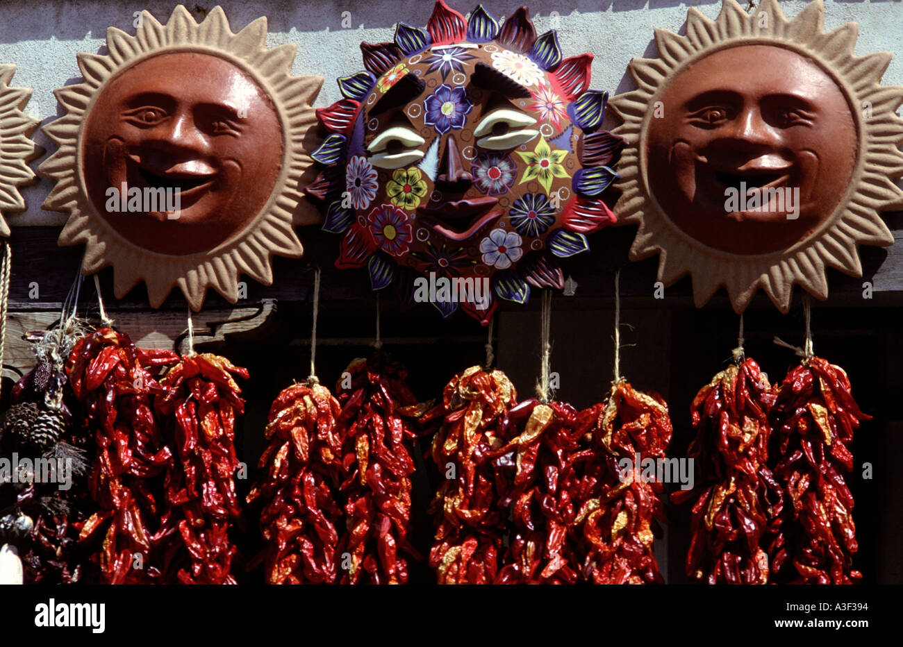 pottery faces and chili ristras Santa Fe New Mexico Stock Photo - Alamy