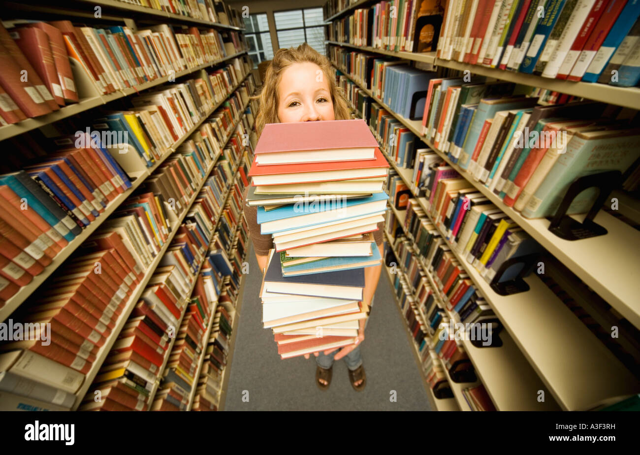 Student in the library Stock Photo - Alamy