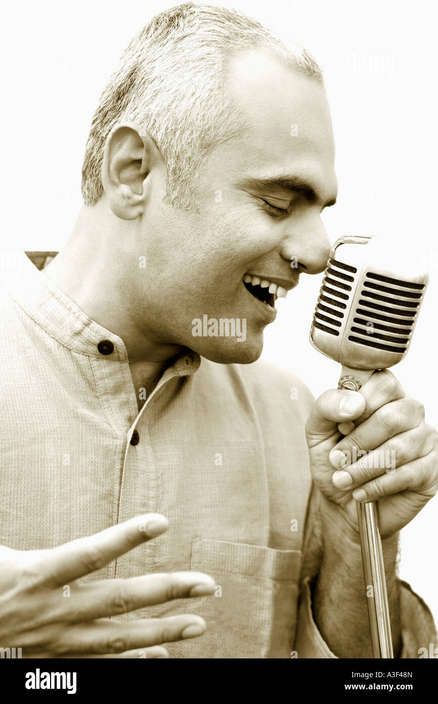 Vertical image man singing microphone hi-res stock photography and ...