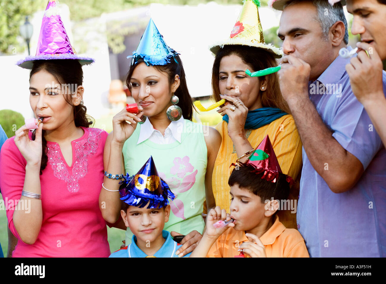 Group of people celebrating a birthday party Stock Photo - Alamy