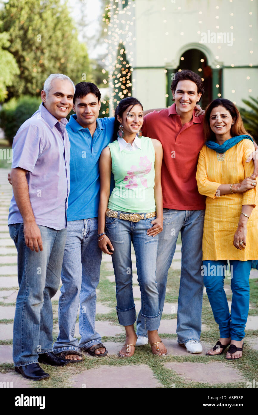 Portrait of five people standing together and smiling Stock Photo - Alamy