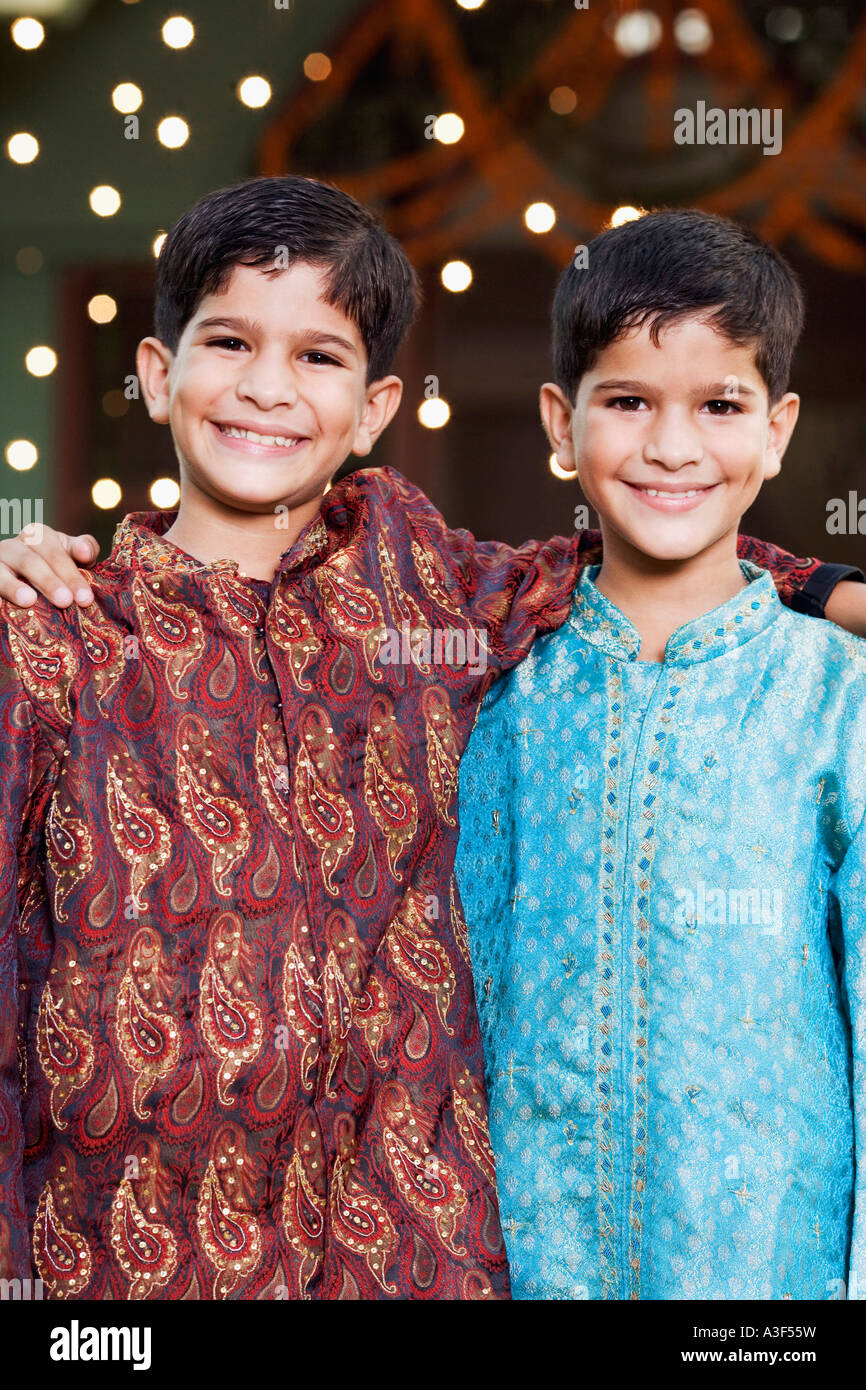 Portrait of twin brothers standing together Stock Photo - Alamy