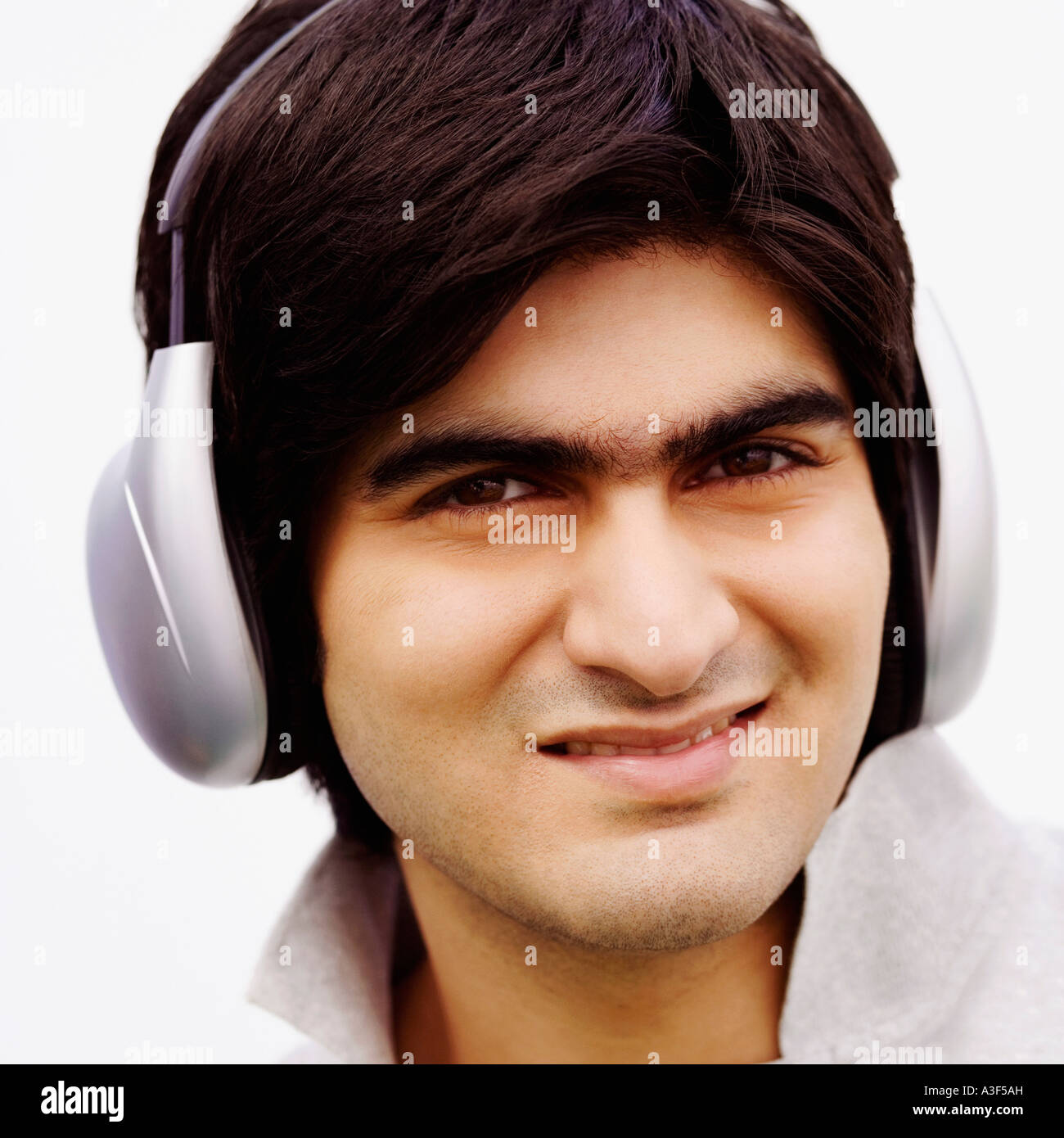 Portrait of a young man wearing headphones Stock Photo - Alamy