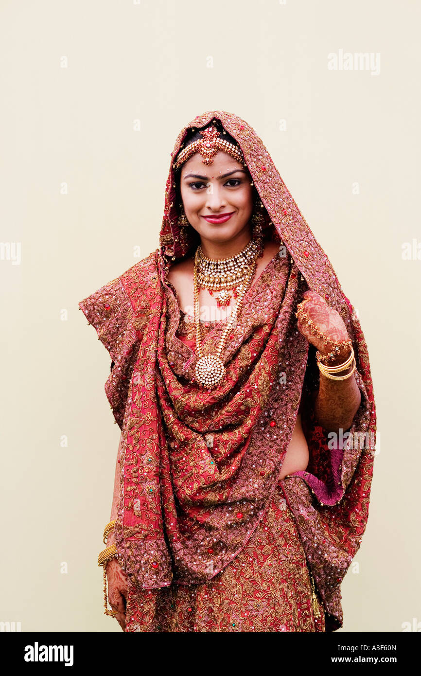 Portrait of a bride in a traditional wedding dress smiling Stock Photo ...