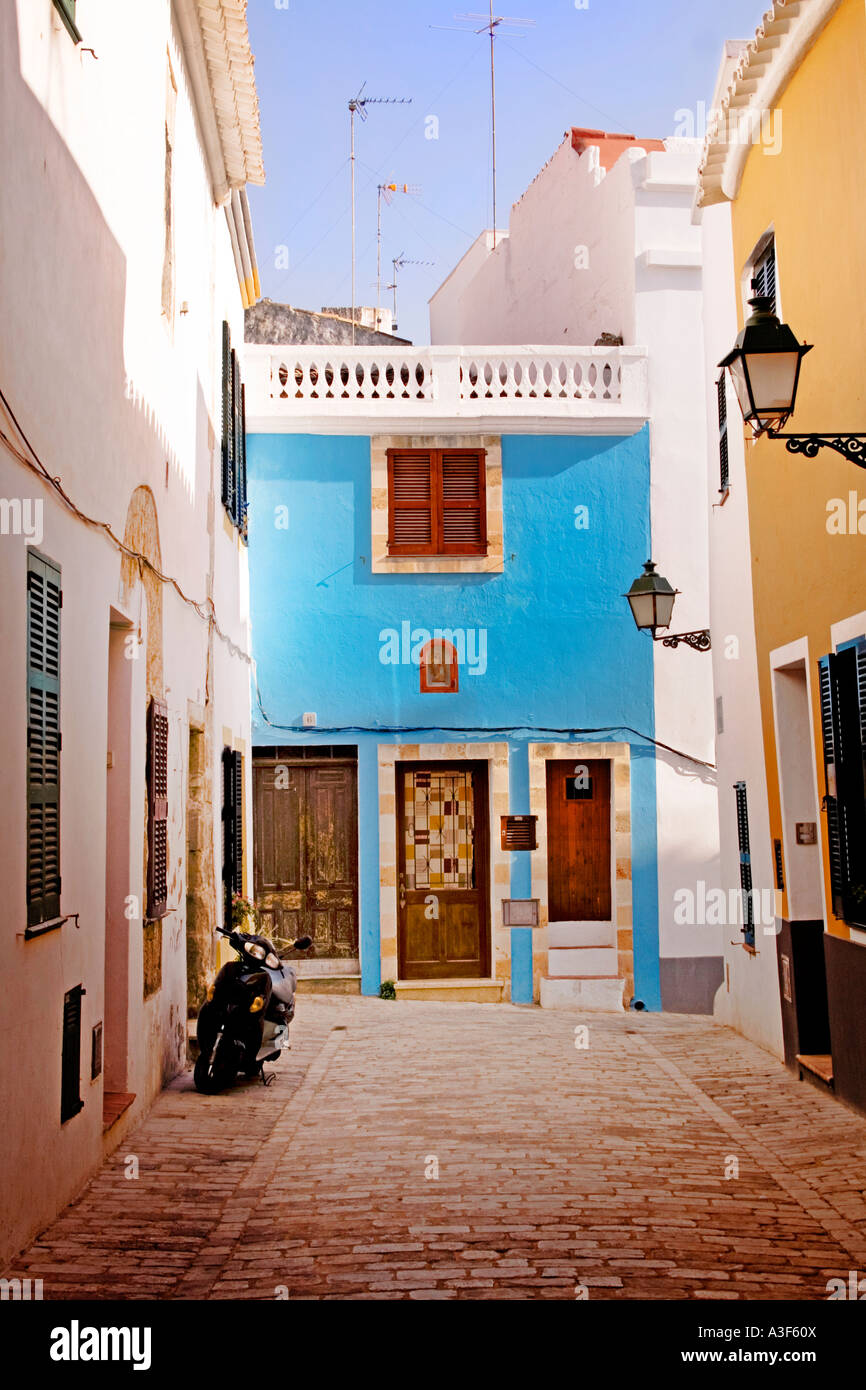 pretty blue house at end of narrow street in menorca spain Stock Photo ...