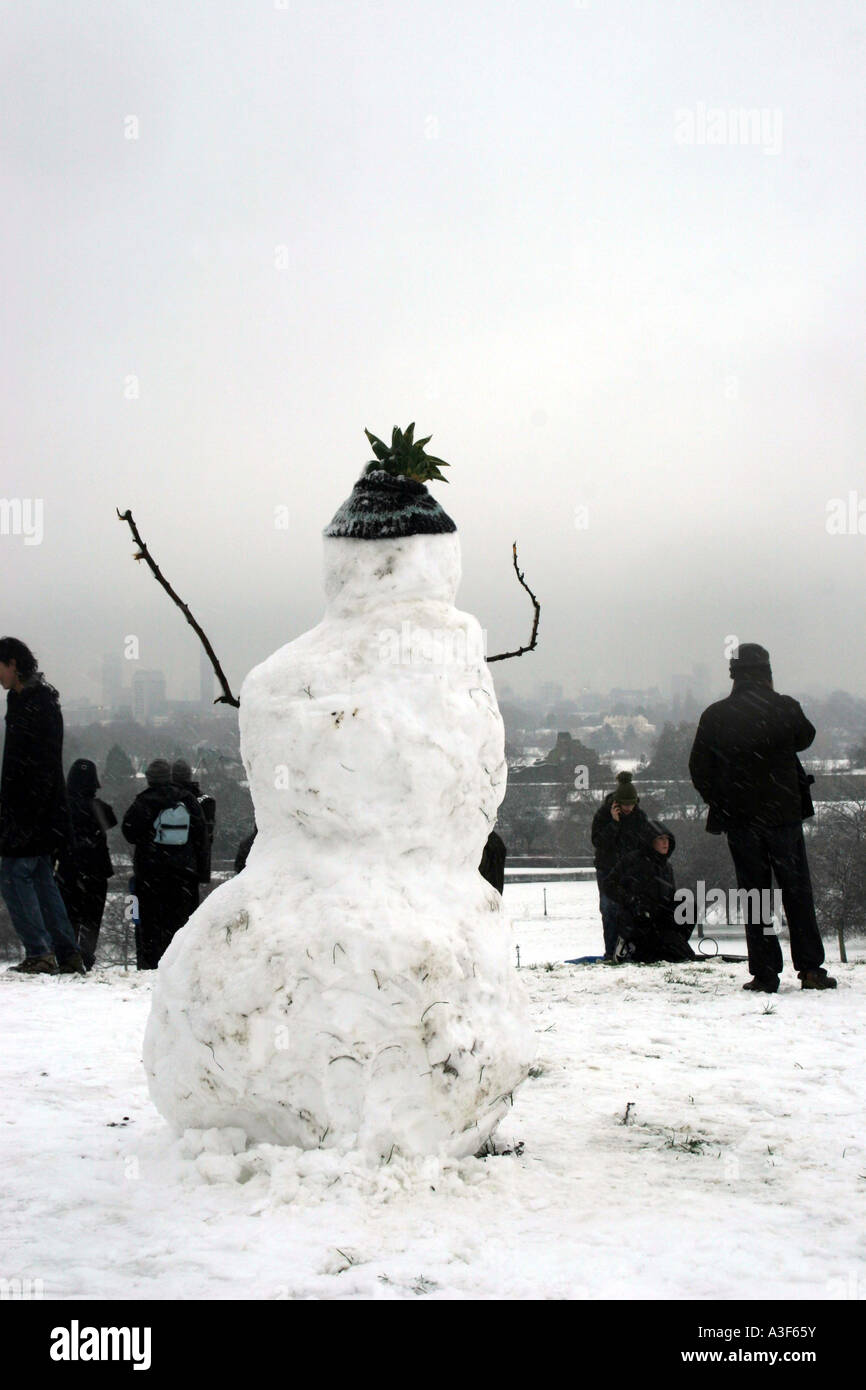 Snowman enjoying view of Primrose Hill London Stock Photo - Alamy