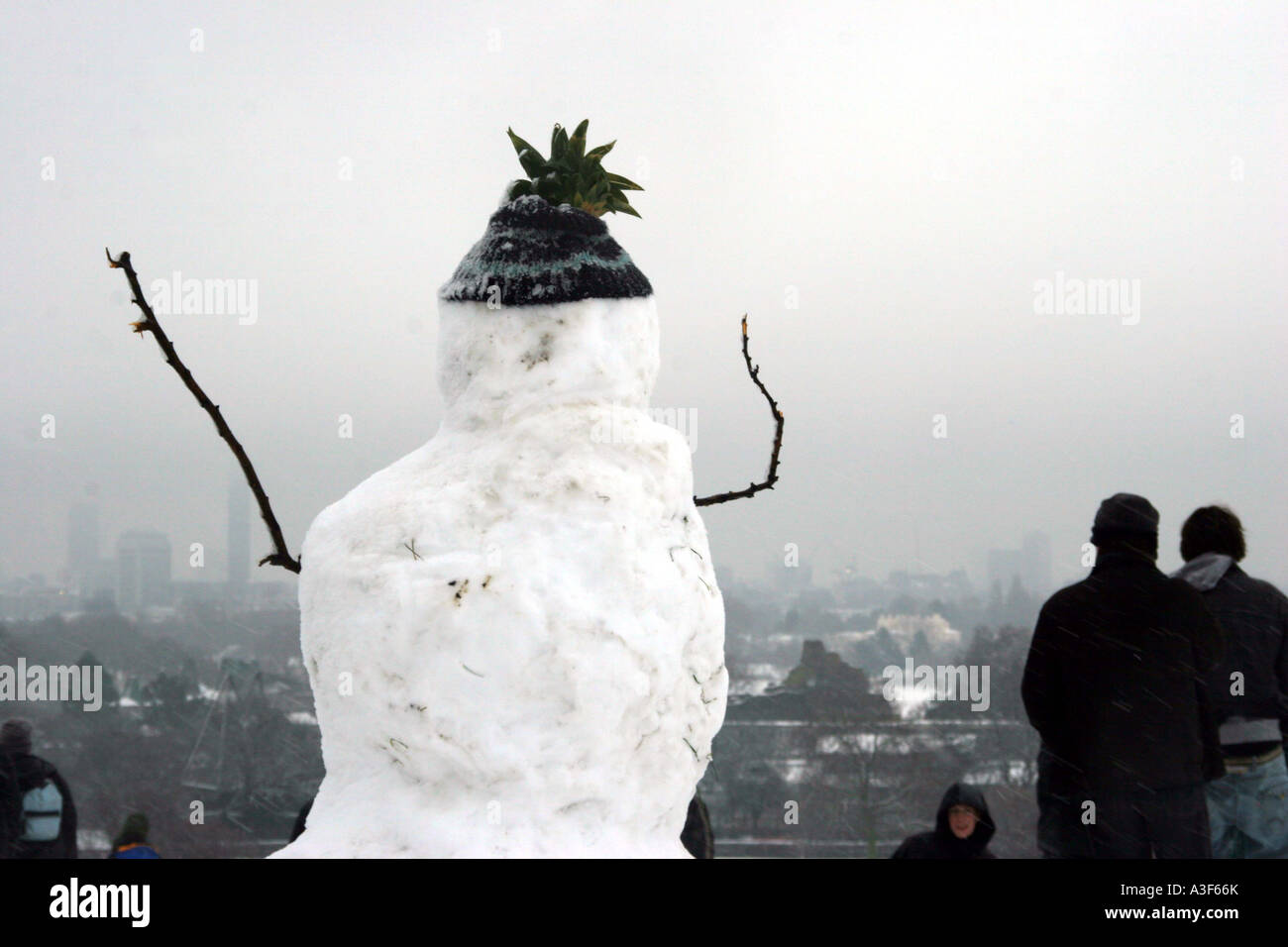 Snowman enjoying view of Primrose Hill London Stock Photo - Alamy