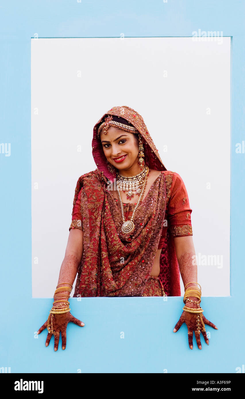 Portrait of a bride in a traditional wedding dress smiling Stock Photo ...