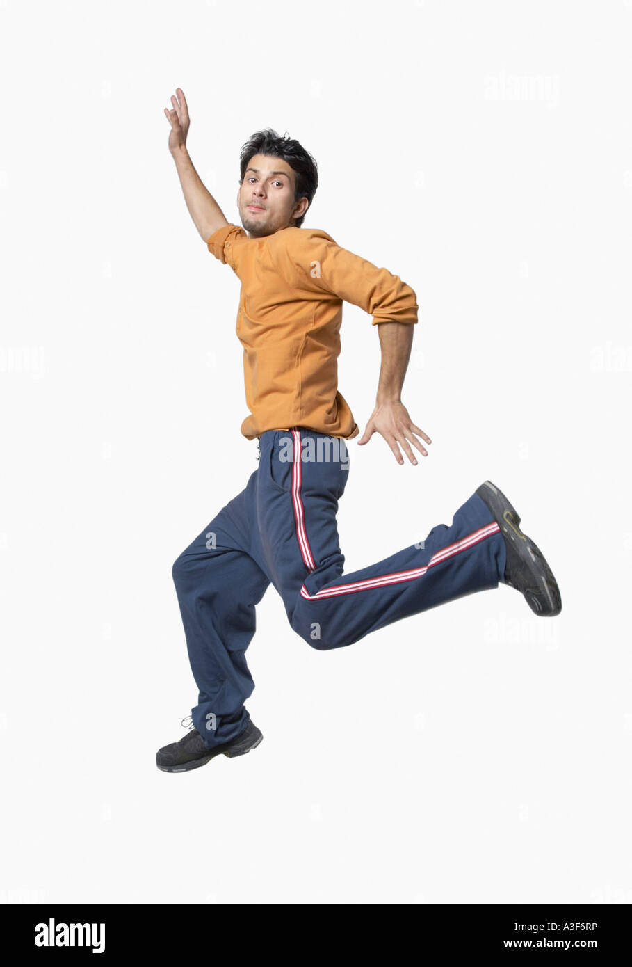 Side profile of a young man jumping Stock Photo - Alamy