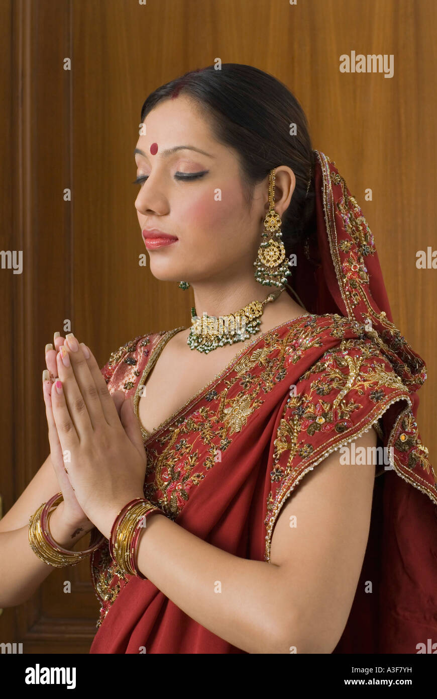 Standing eyes closed praying religion spirituality hi-res stock ...