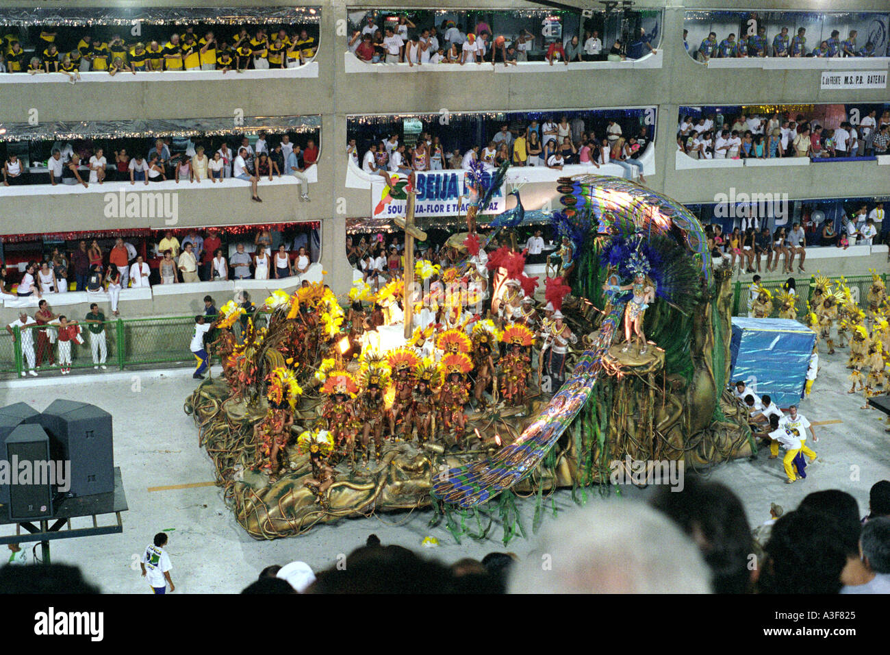 Men and women in costume dancing parading in the road in Rio Carnival ...