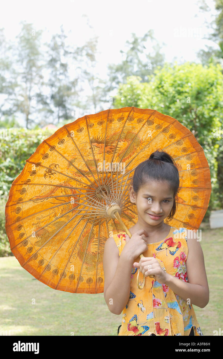 Girl holding a parasol Stock Photo - Alamy