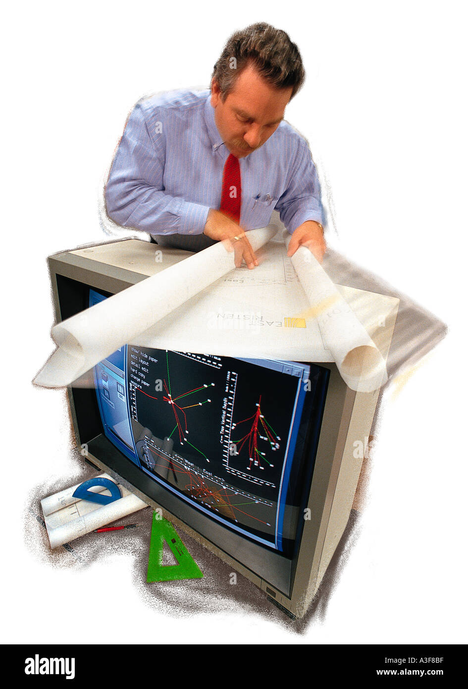 Caucasian male engineer reviews construction document on top of monitor ...