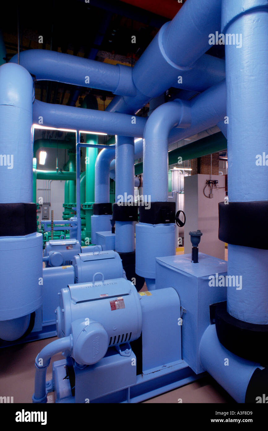 Industrial mechanical room with blue pipes and pumps Stock Photo - Alamy