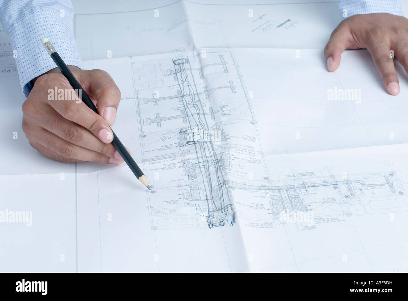 Close-up of an architect's hands drawing a blueprint Stock Photo - Alamy