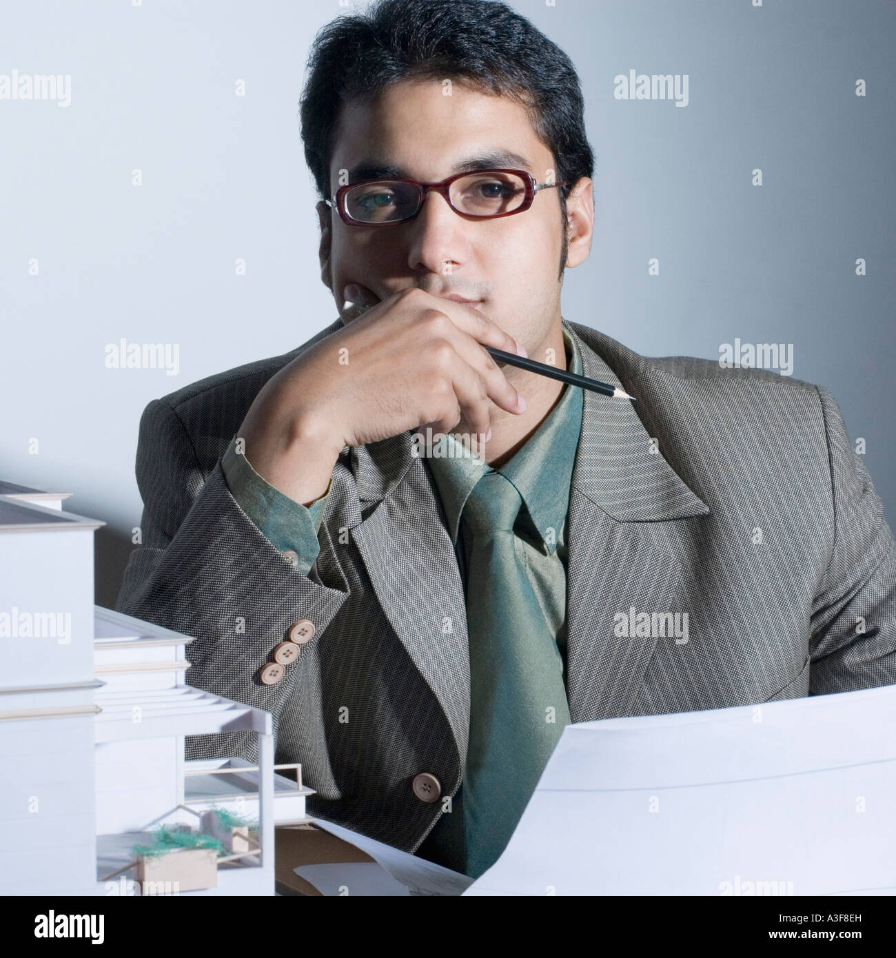 Portrait of an architect thinking Stock Photo - Alamy