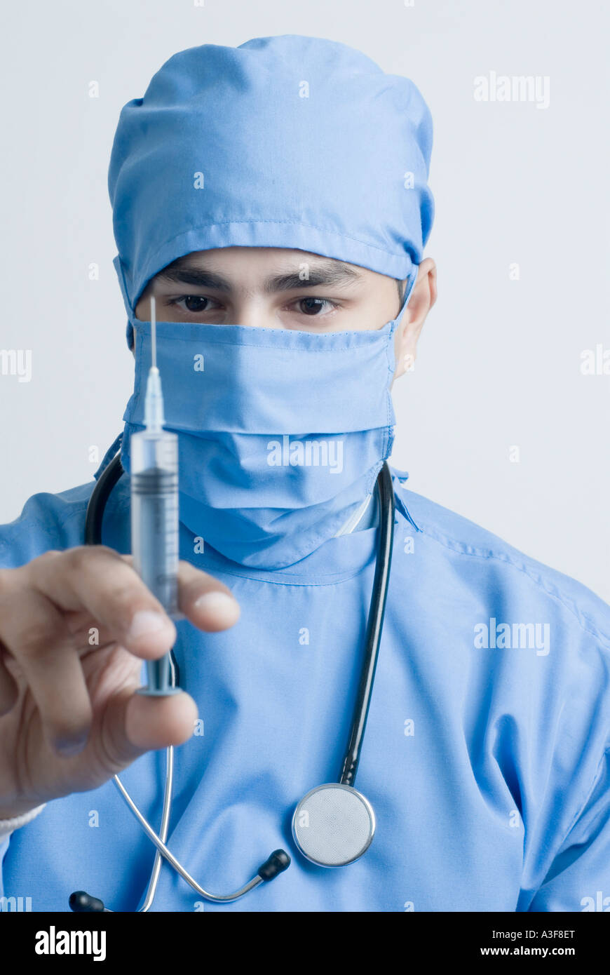 Close-up of a surgeon holding a syringe Stock Photo - Alamy