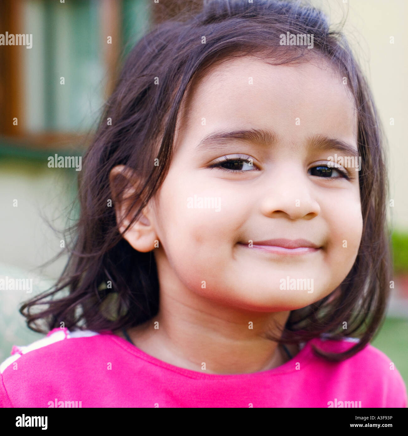 Portrait of a girl smirking Stock Photo - Alamy
