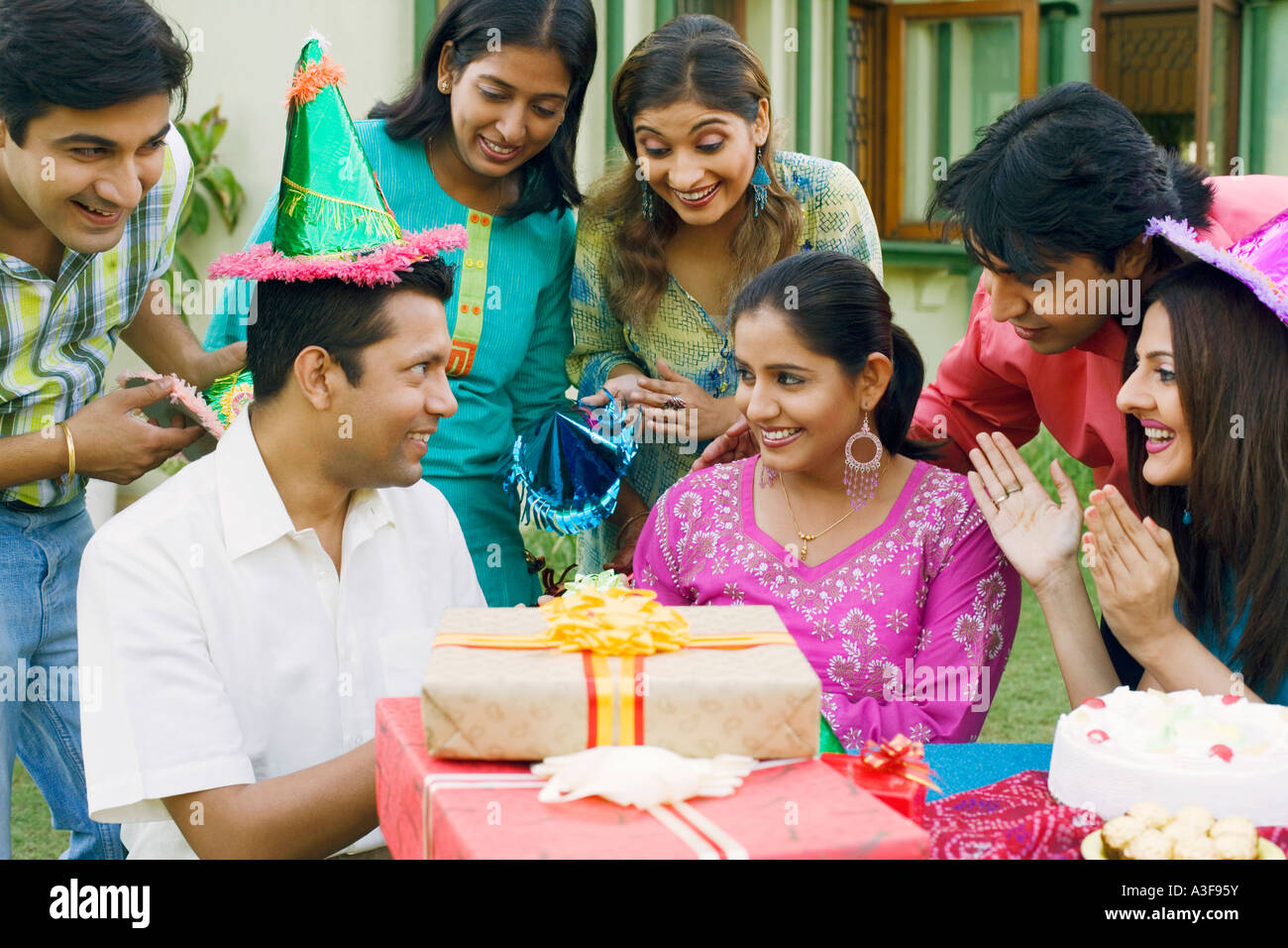 Group of people celebrating a birthday party Stock Photo - Alamy