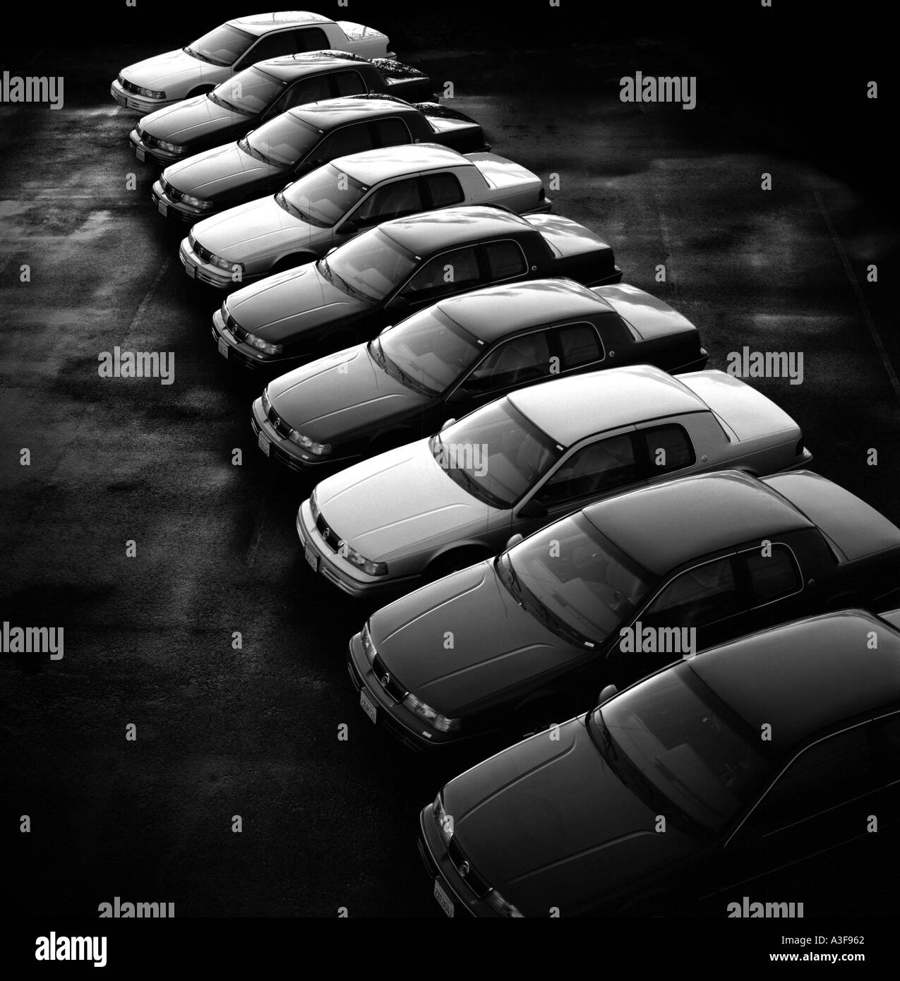 Automobiles of the same make and model in a row Stock Photo - Alamy