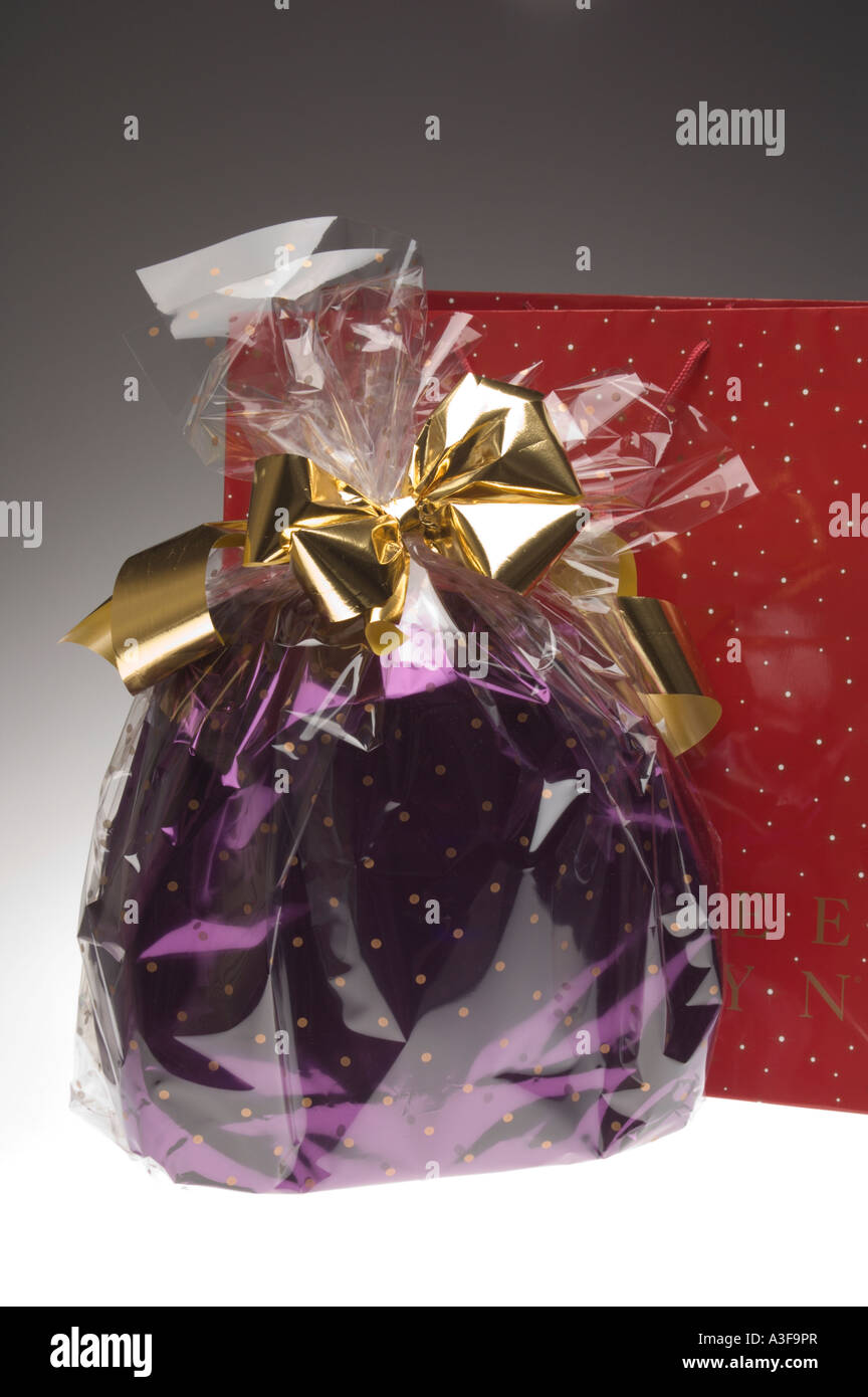 Gift wrapped present wrapped by store Stock Photo - Alamy