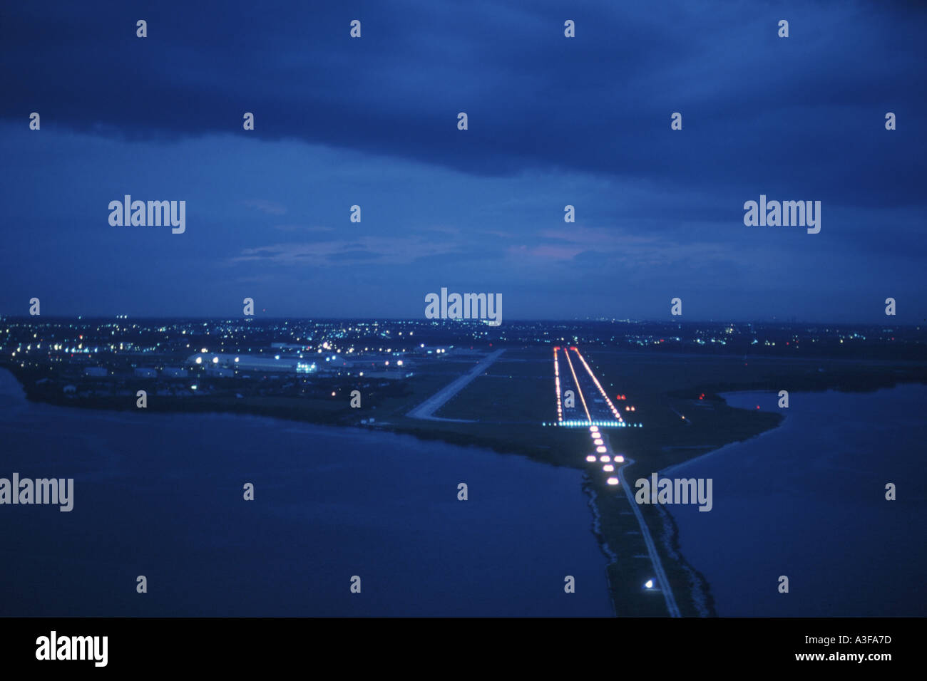 Aerial of airport runway lights at night Stock Photo - Alamy