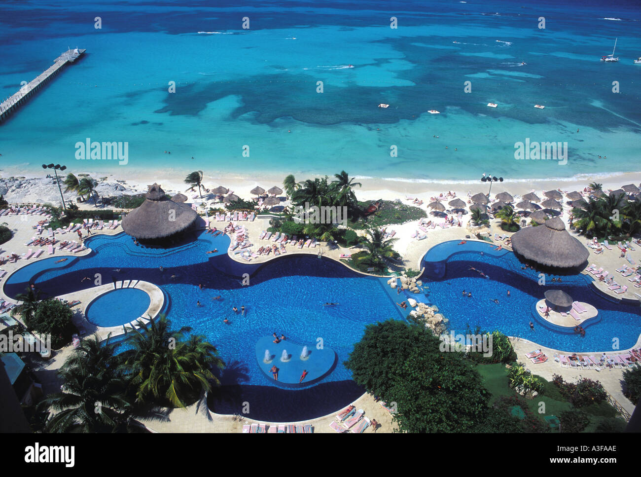 Mexico Cancun overview of swimming pool and Caribbean sea Stock Photo ...