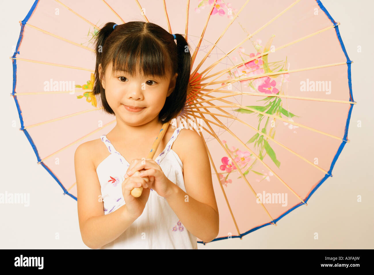Portrait of a girl holding a parasol Stock Photo - Alamy