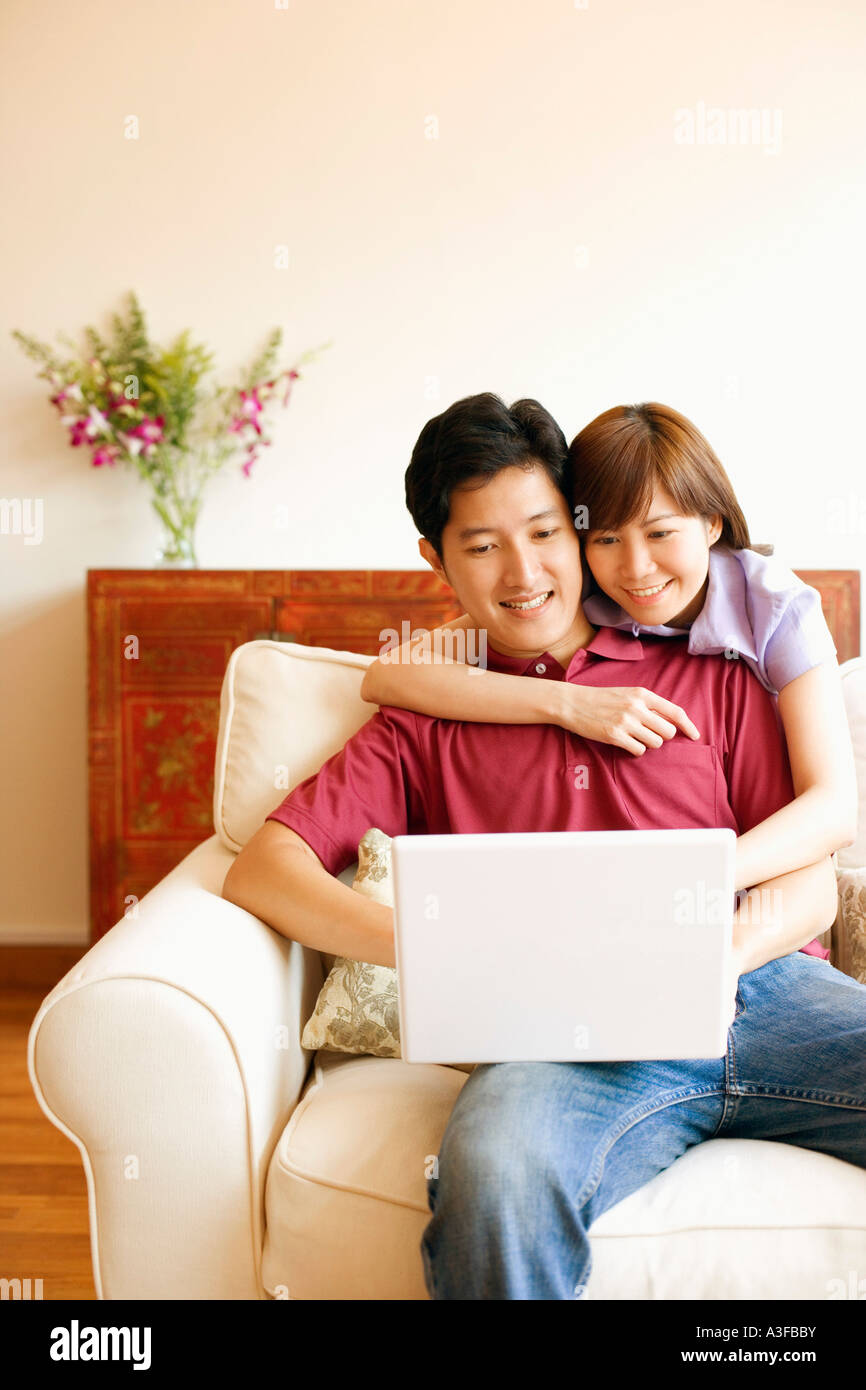 Young couple laptop around hi-res stock photography and images - Alamy