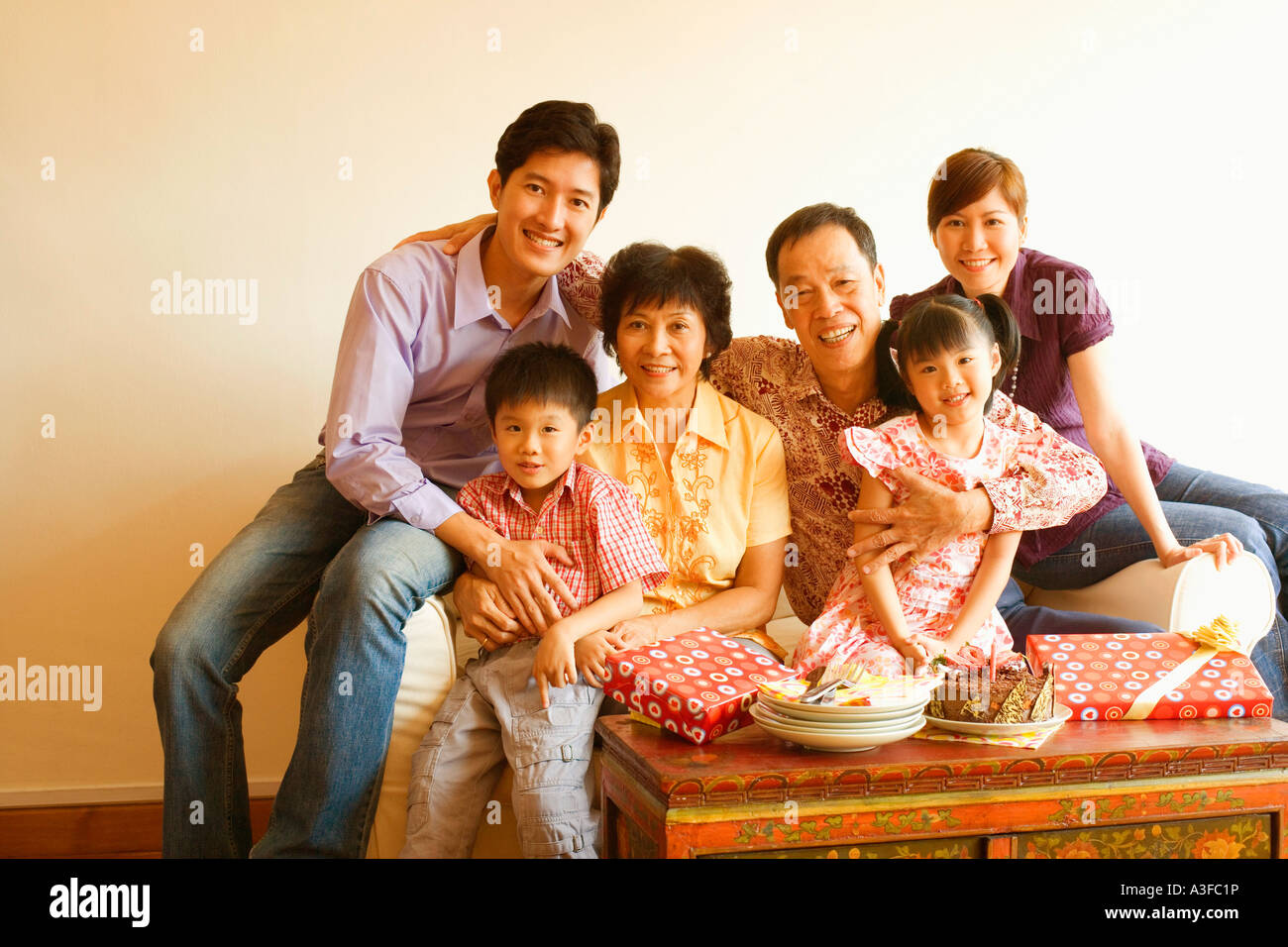 Portrait of a family celebrating a birthday party Stock Photo - Alamy