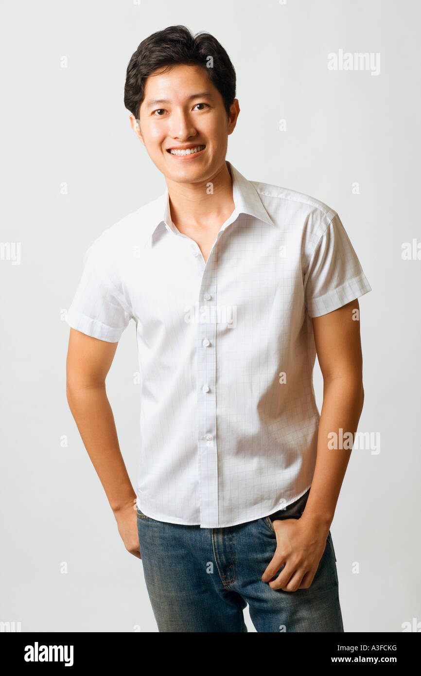 Smiling chinese man standing open hi-res stock photography and images ...