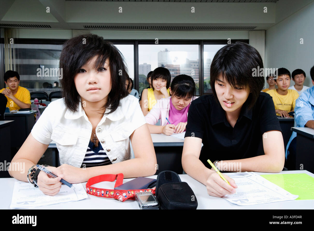 Teenage boy in a classroom Stock Photo - Alamy