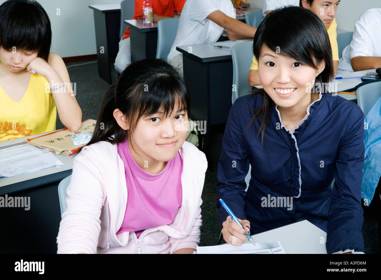 Young women filling school form hi-res stock photography and images - Alamy