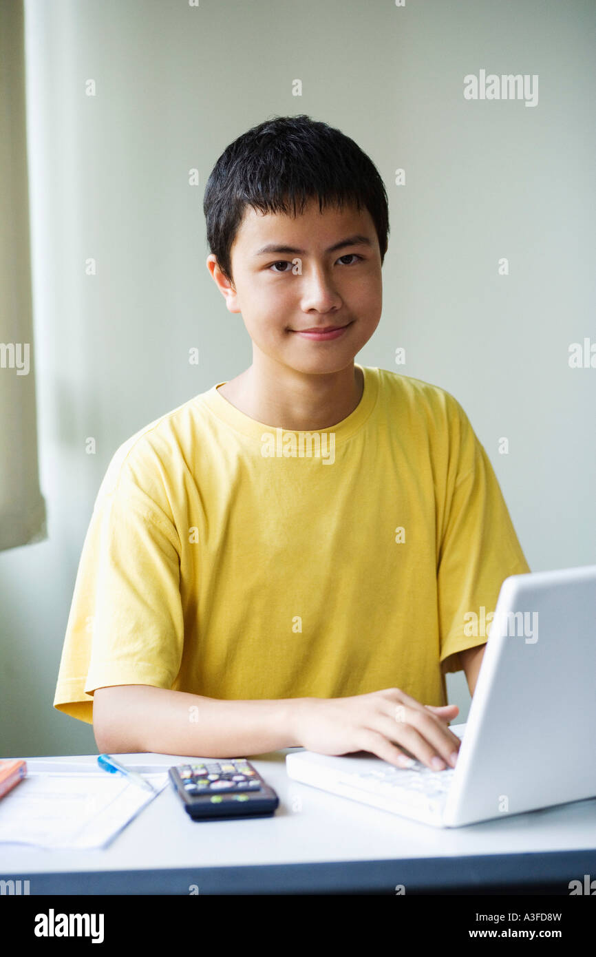 Portrait of a boy using a laptop Stock Photo - Alamy