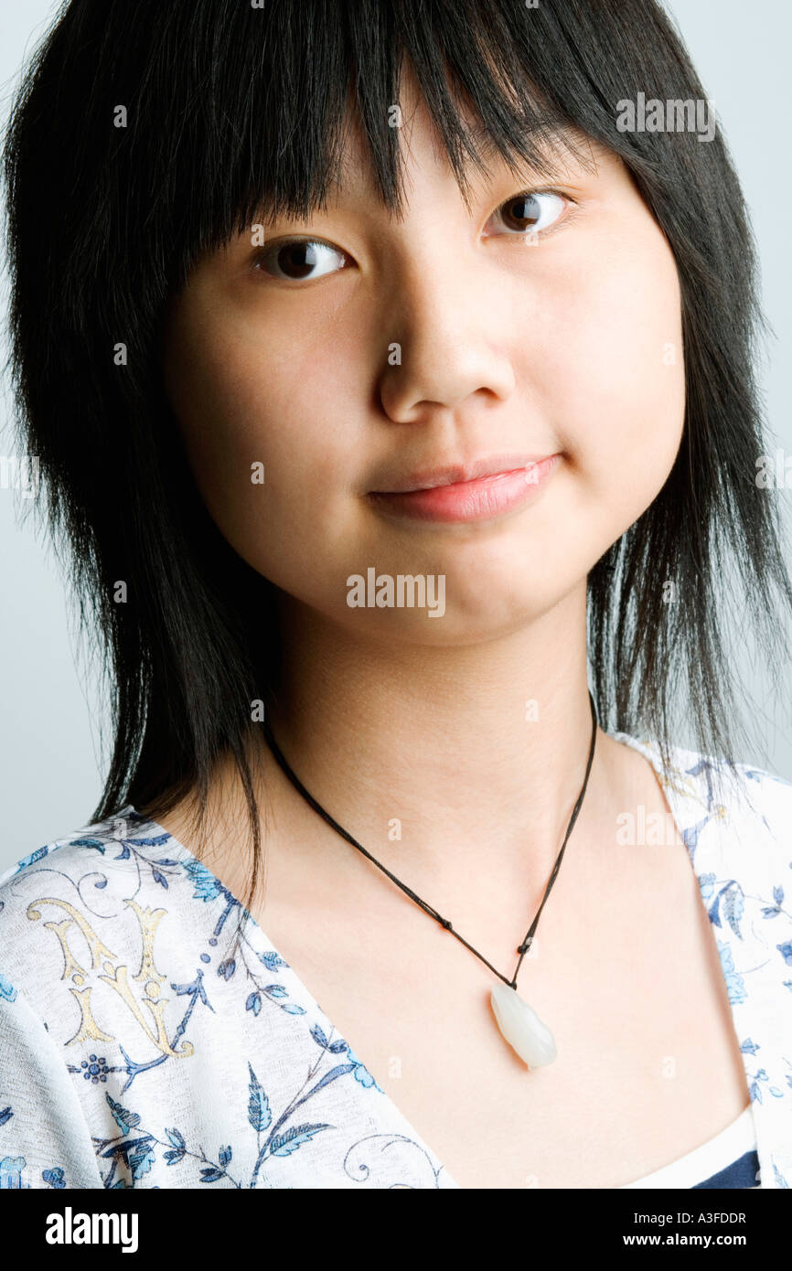 Portrait of a girl smirking Stock Photo - Alamy