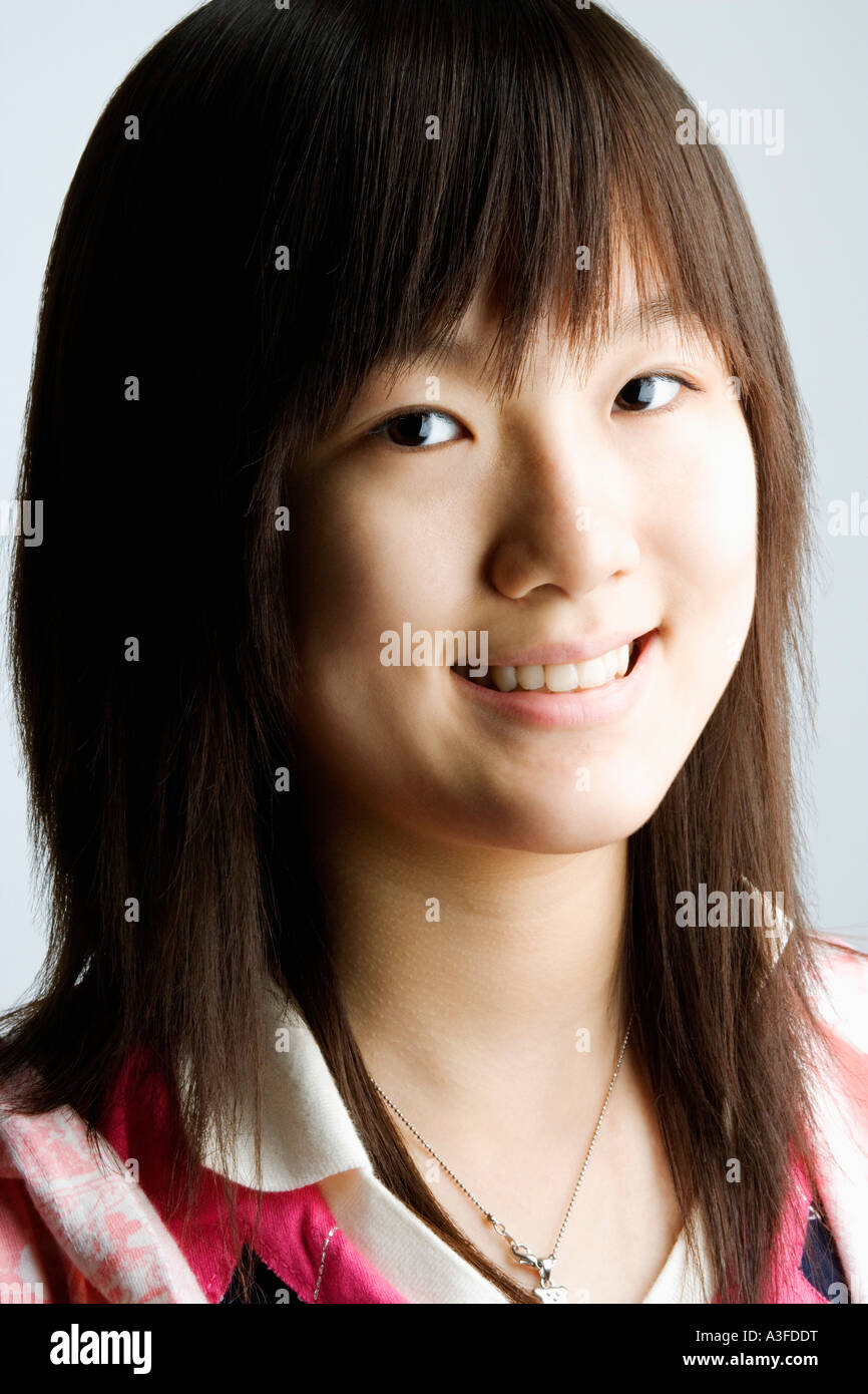 Portrait of a teenage girl smiling Stock Photo - Alamy