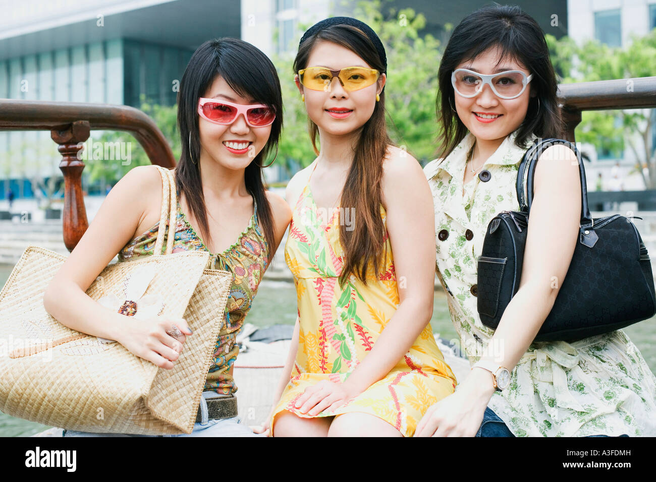 Portrait of three young women smiling Stock Photo - Alamy