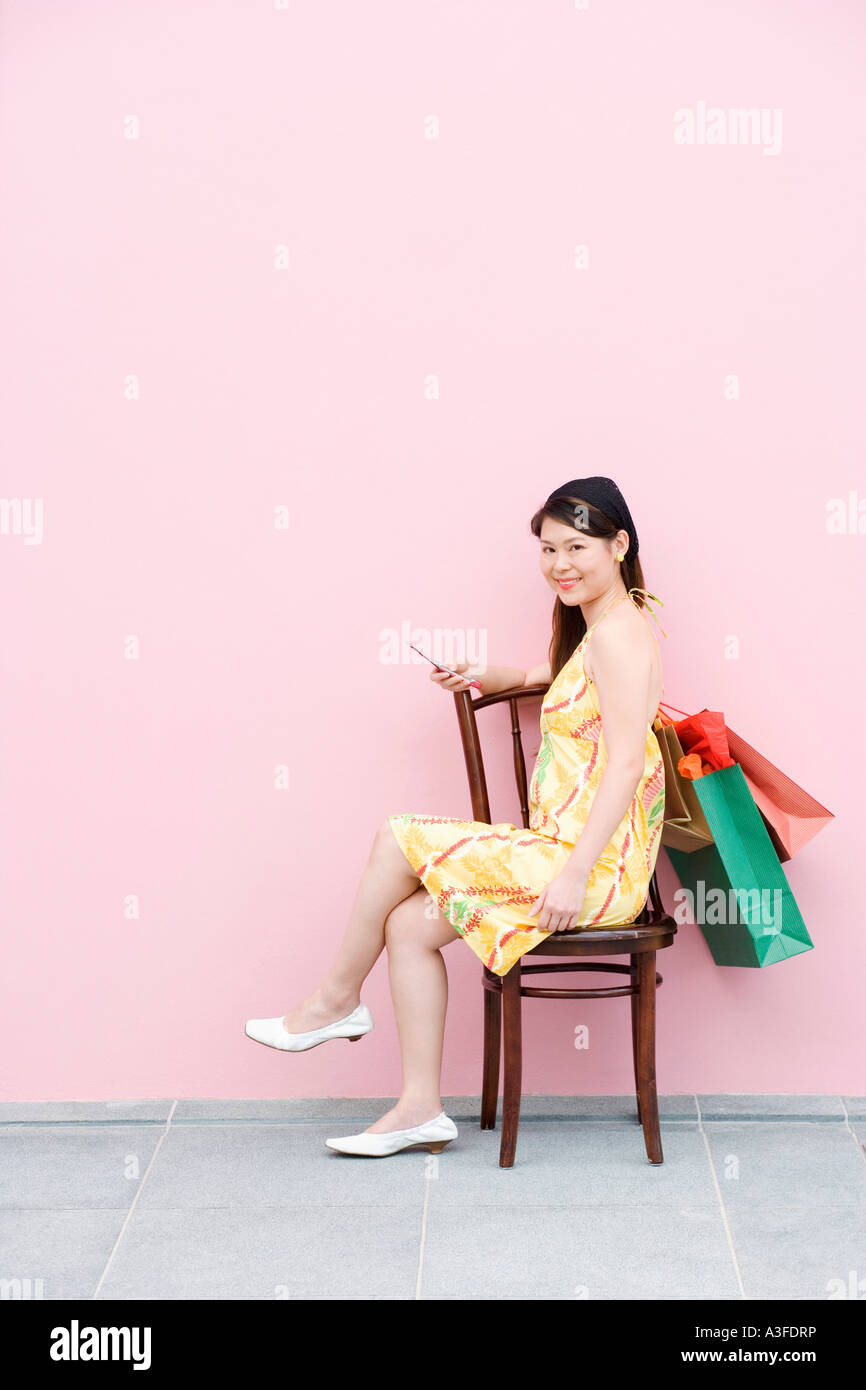 Woman sitting holding legs profile hi-res stock photography and images ...