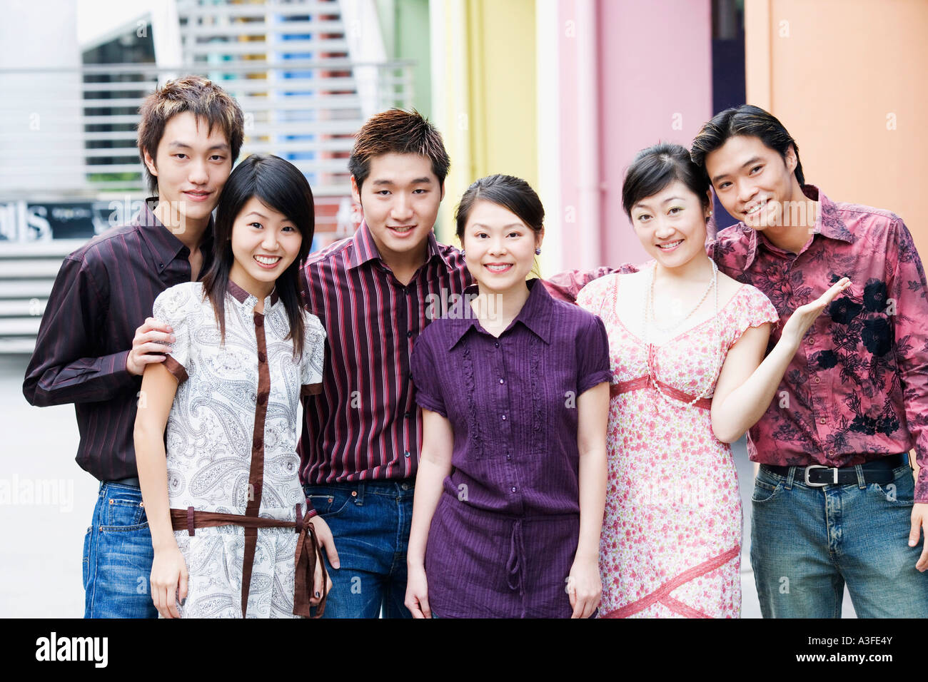Portrait of a group of people standing together and smiling Stock Photo ...