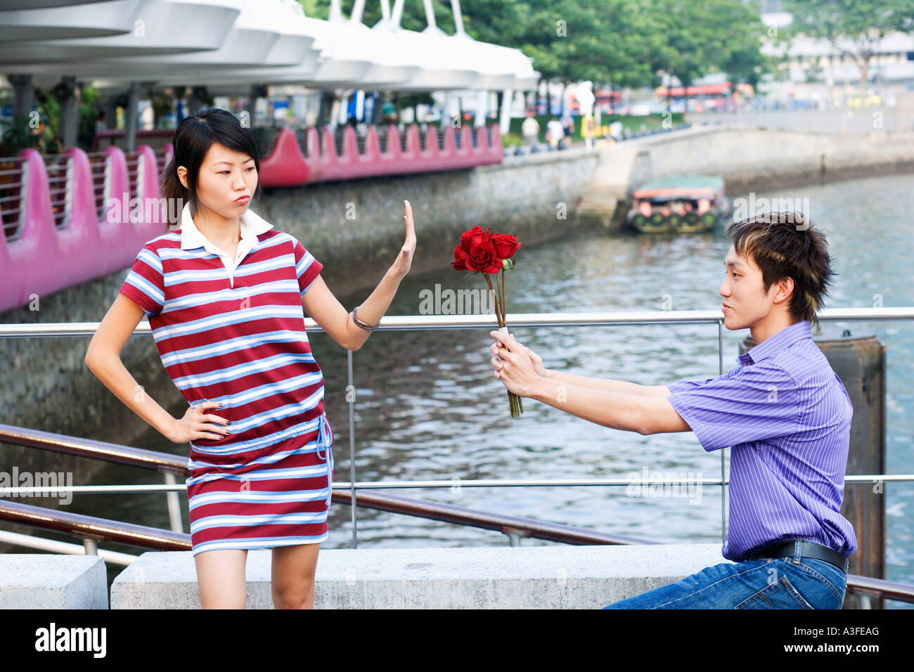 Side profile of a young man proposing a young woman Stock Photo - Alamy