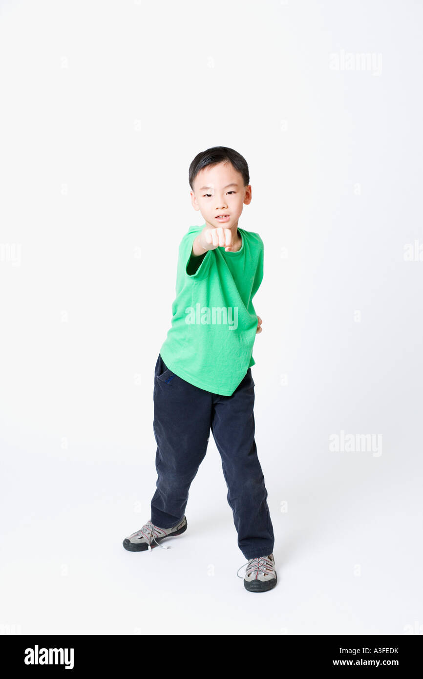 Portrait of a boy in a fighting stance Stock Photo - Alamy