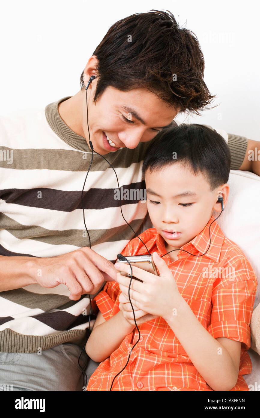 Son listening to mp3 player hi-res stock photography and images - Alamy